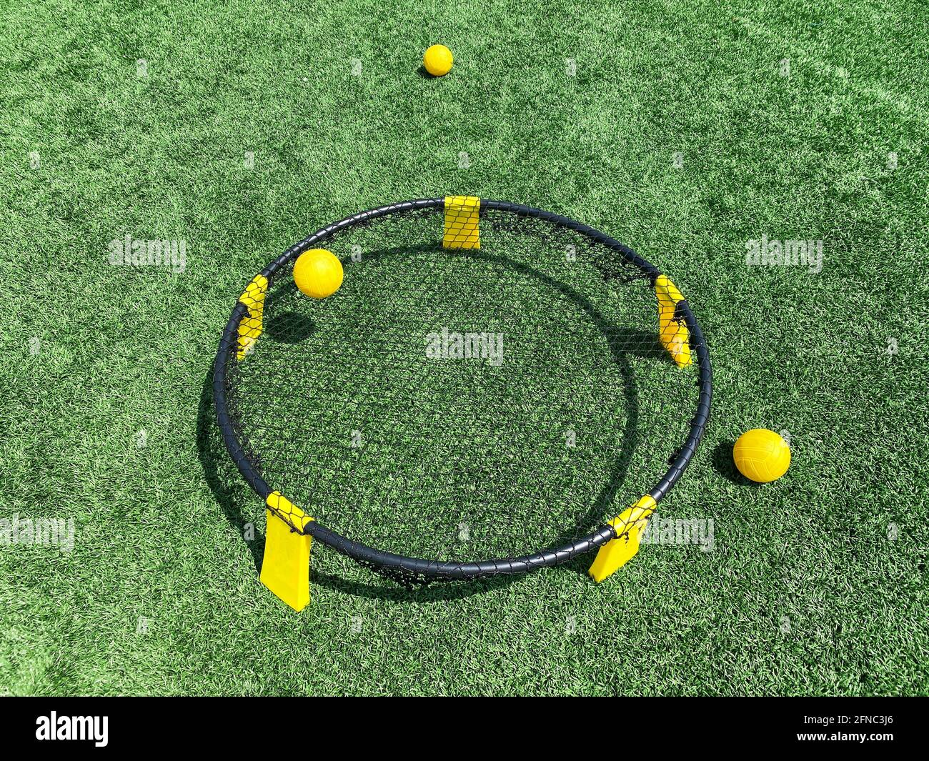 Spike ball game yellow hi-res stock photography and images - Alamy