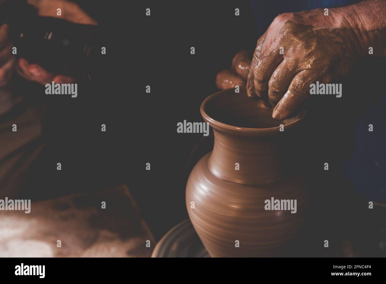 Craftsman hands making ceramic pot Stock Photo - Alamy