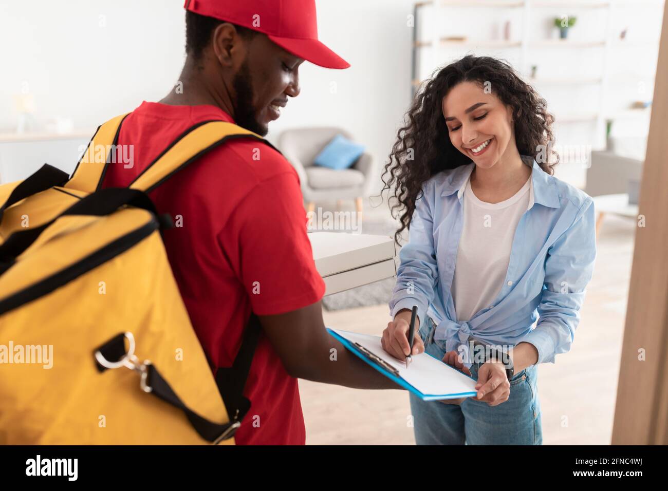 Customer Receiving Order From Restaurant Signing Paper Form Stock Photo ...
