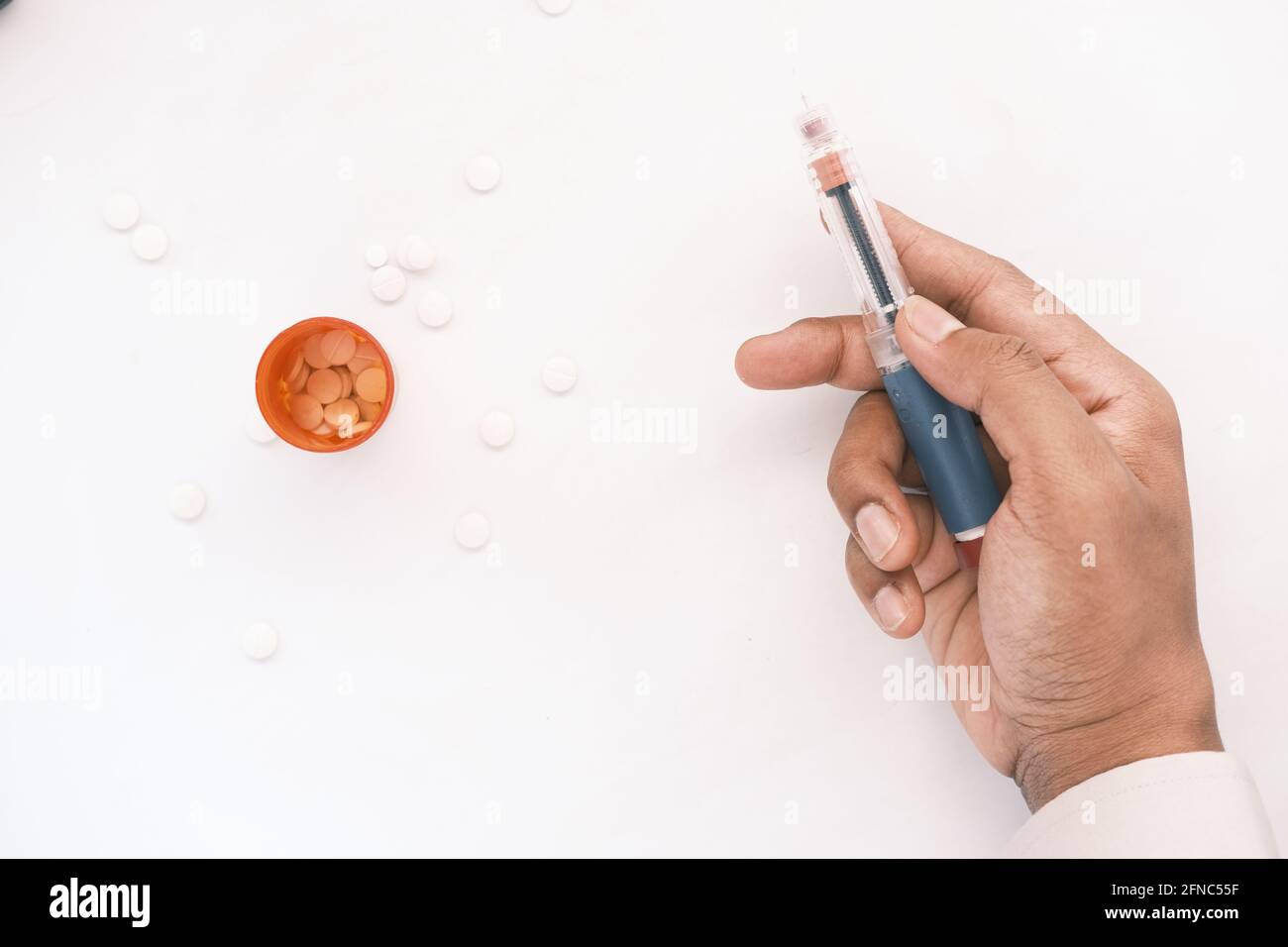 hand holding Insulin pens on white background, close up Stock Photo - Alamy