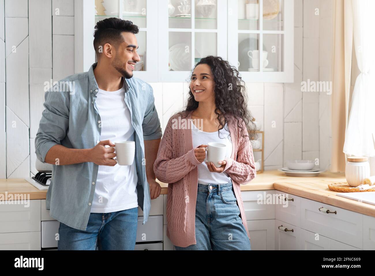 Portrait Of Romantic Young Arab Spouses Drinking Morning Coffee In ...