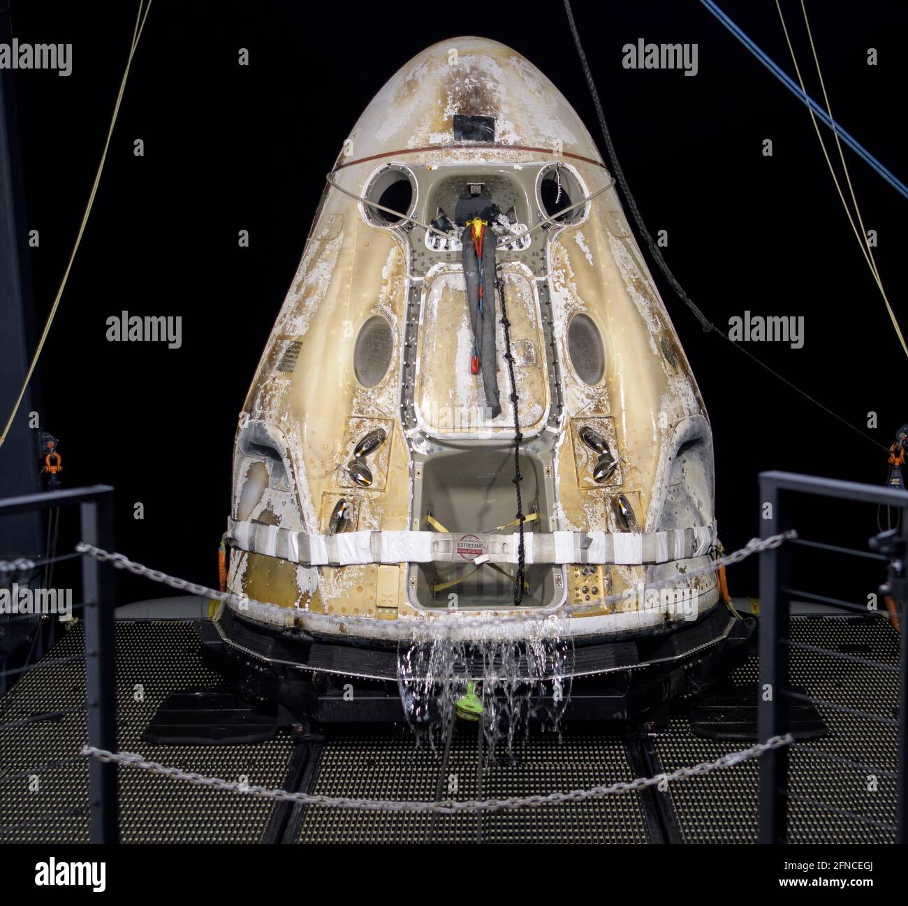 The SpaceX Crew Dragon Resilience spacecraft is lifted onto the GO ...