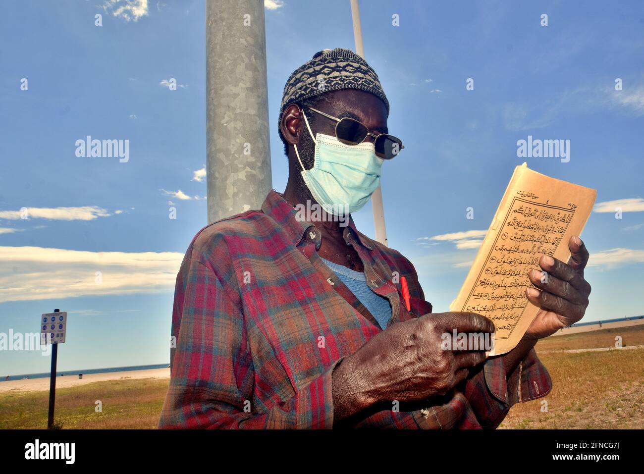 A Muslim man wearing a face mask as a preventive measure against Covid ...