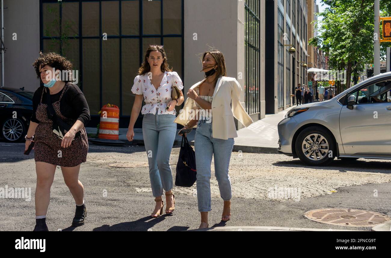 Masked and maskless people in Chelsea in New York on Saturday, May 15 ...