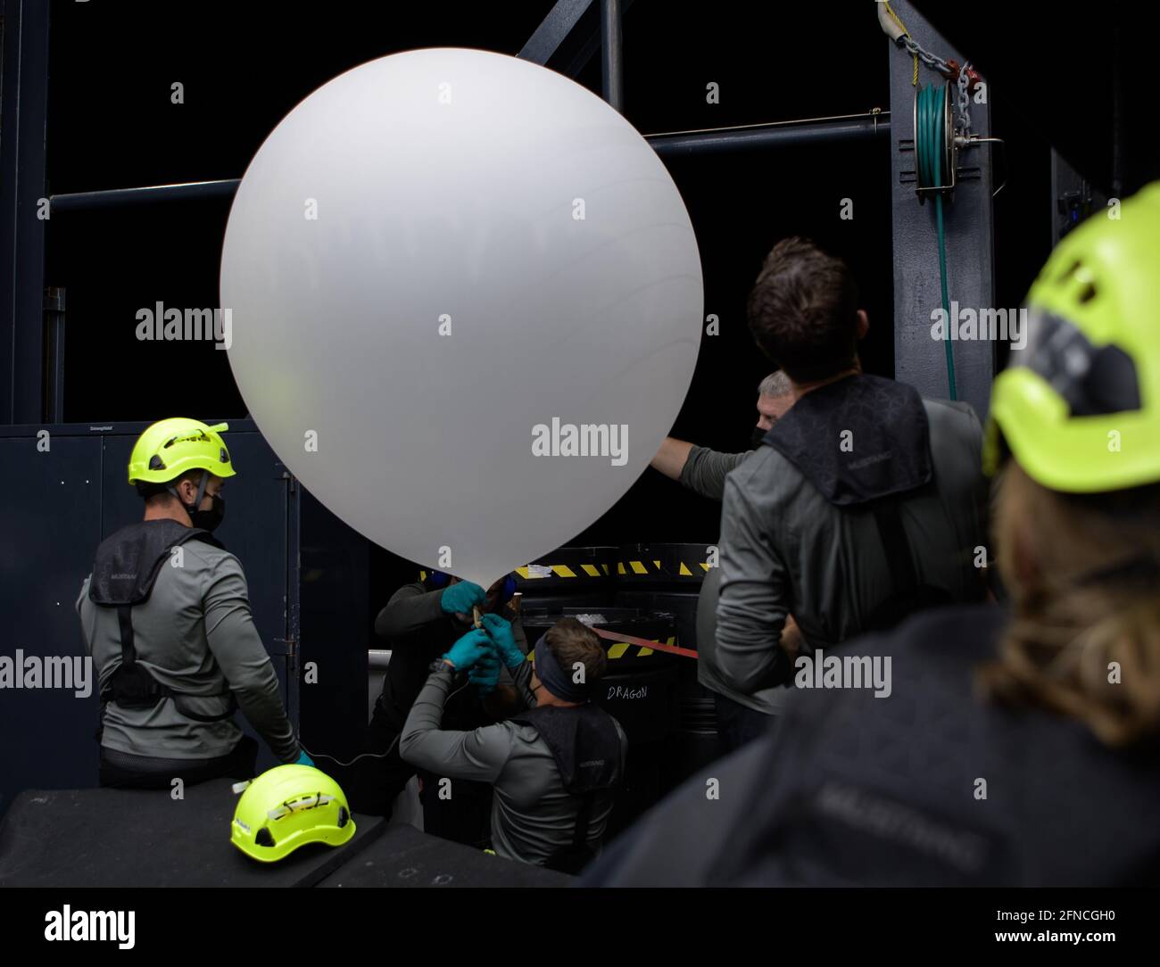 SpaceX support teams onboard the GO Navigator recovery launch a weather ...