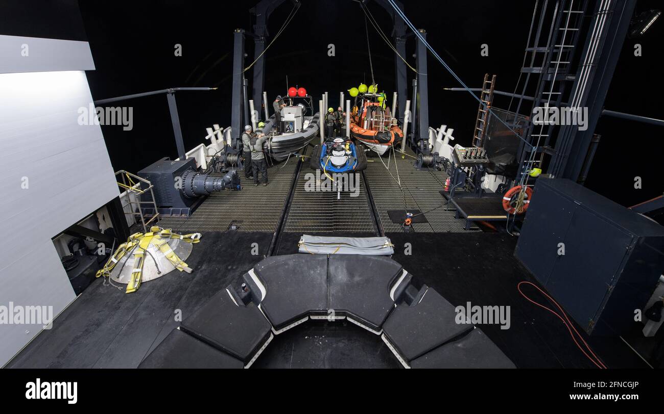 SpaceX support teams onboard the GO Navigator recovery prepare to ...