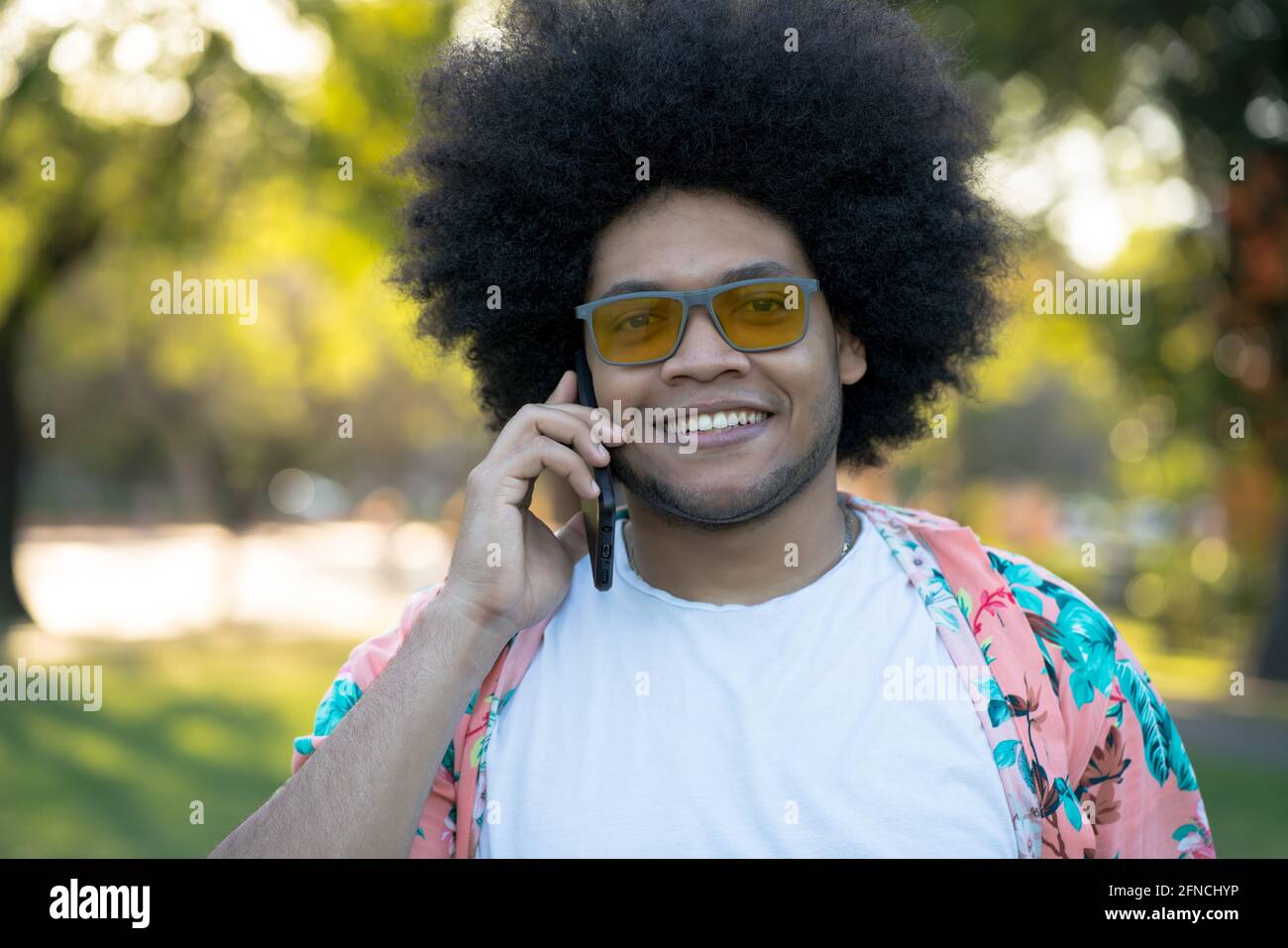 Latin man smiling outside hi-res stock photography and images - Alamy