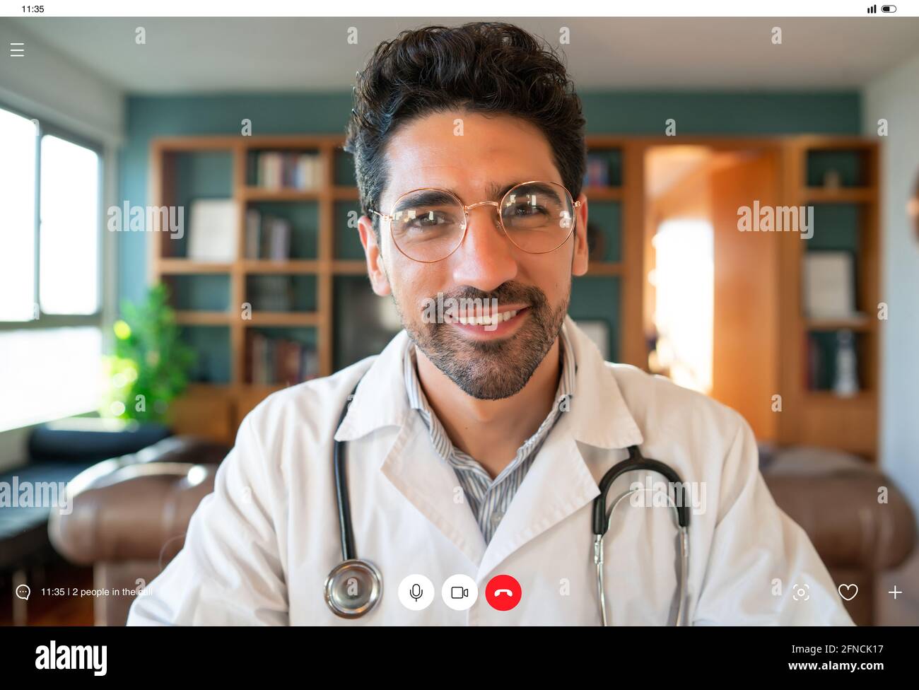 Doctor on a video call with a patient Stock Photo - Alamy