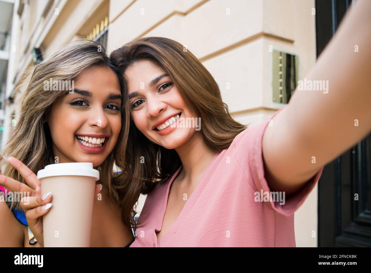 Friends taking funny selfie together outdoors hi-res stock photography ...