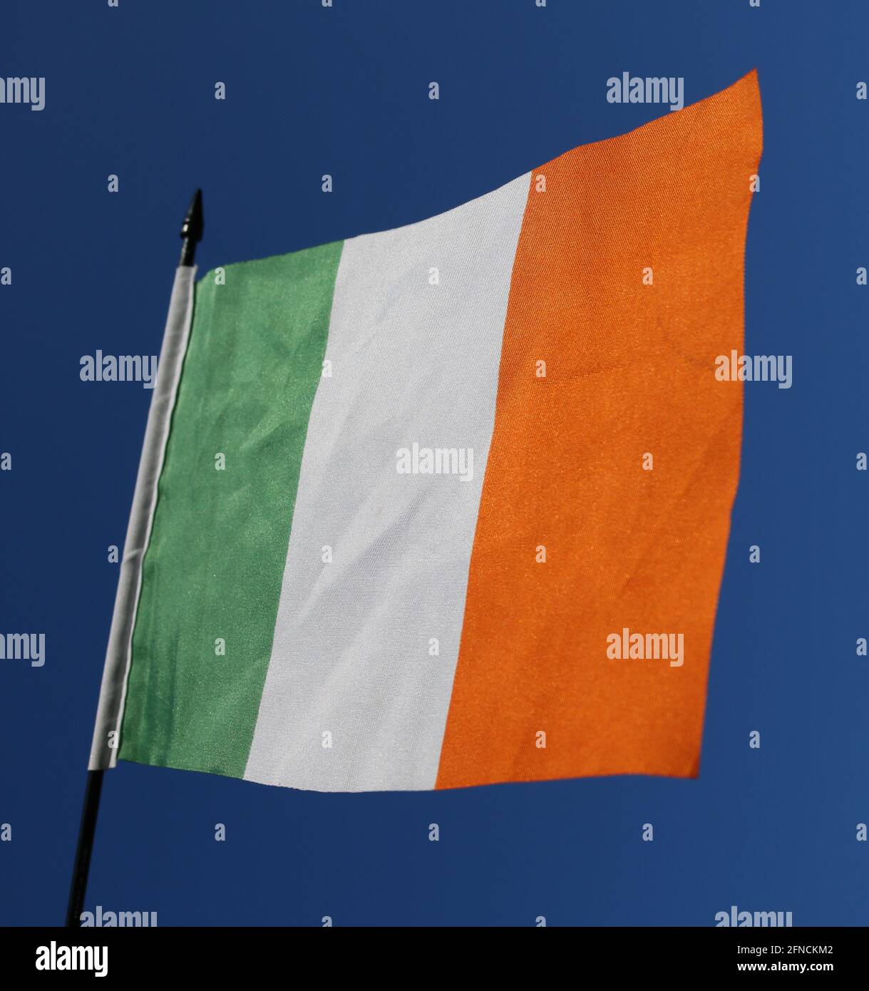 Flag of Ireland flying, Irish flag flying Stock Photo - Alamy