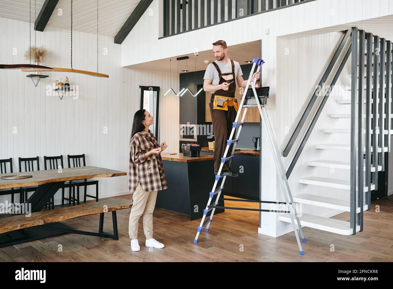 Businessman standing on ladder hi-res stock photography and images - Alamy