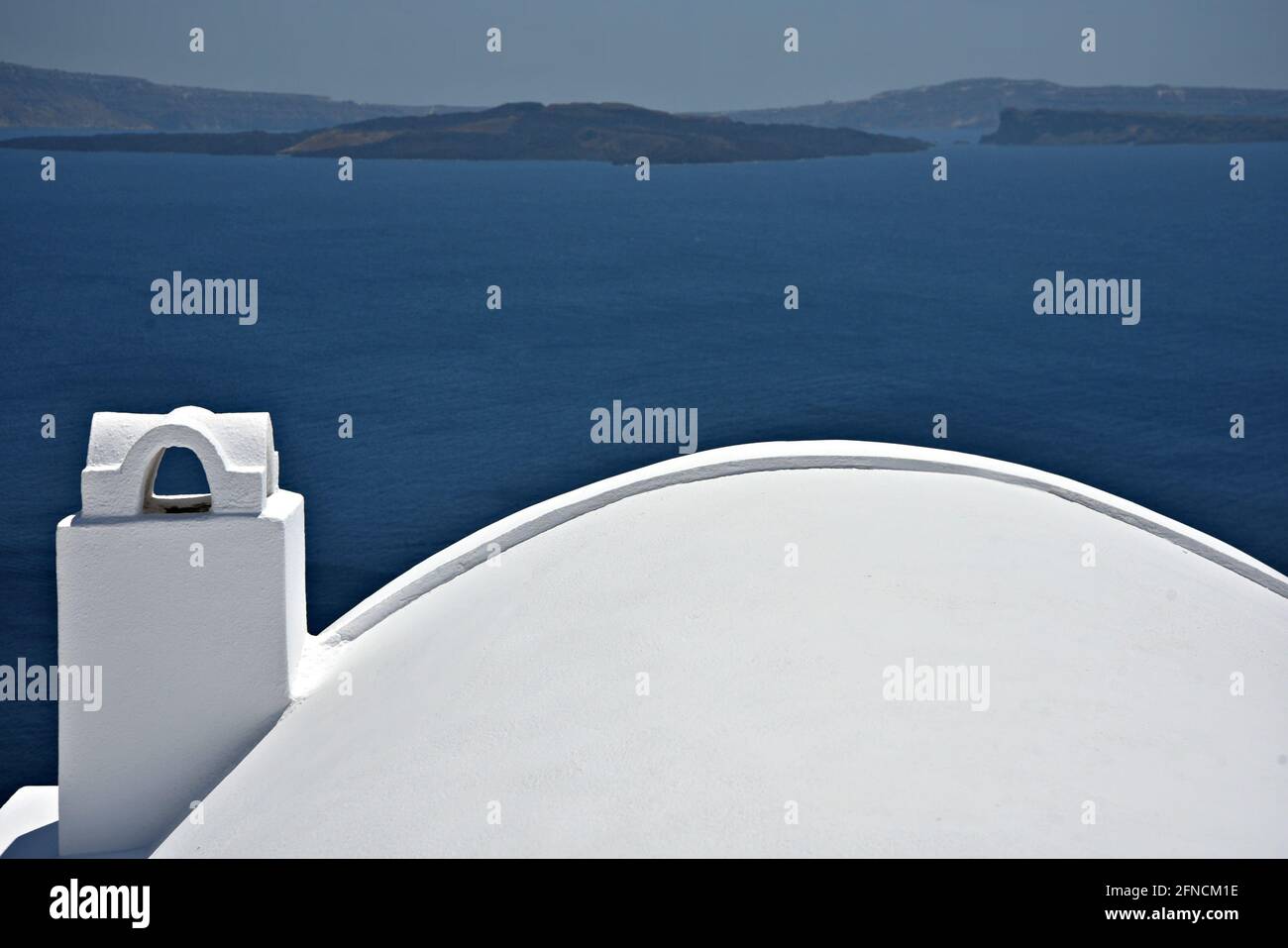 Scenic landscape with a traditional Cycladic adobe house rooftop with ...