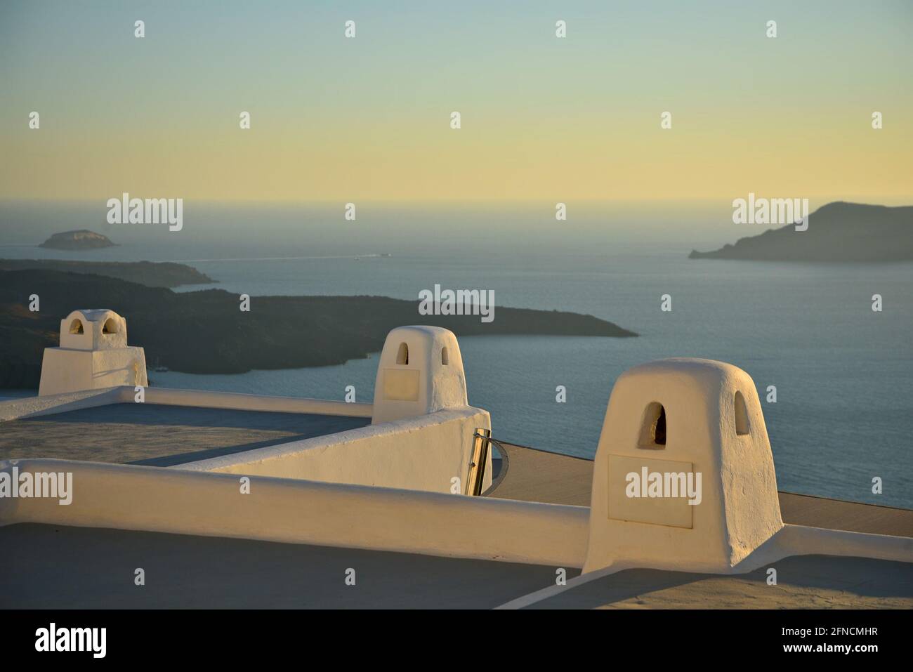 Scenic sunset landscape with a typical Cycladic house overlooking the ...