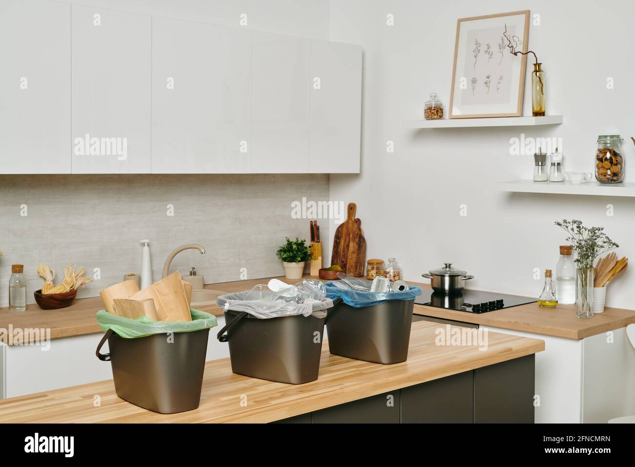 Modern kitchen with kitchenware and group of plastic trash bins Stock ...