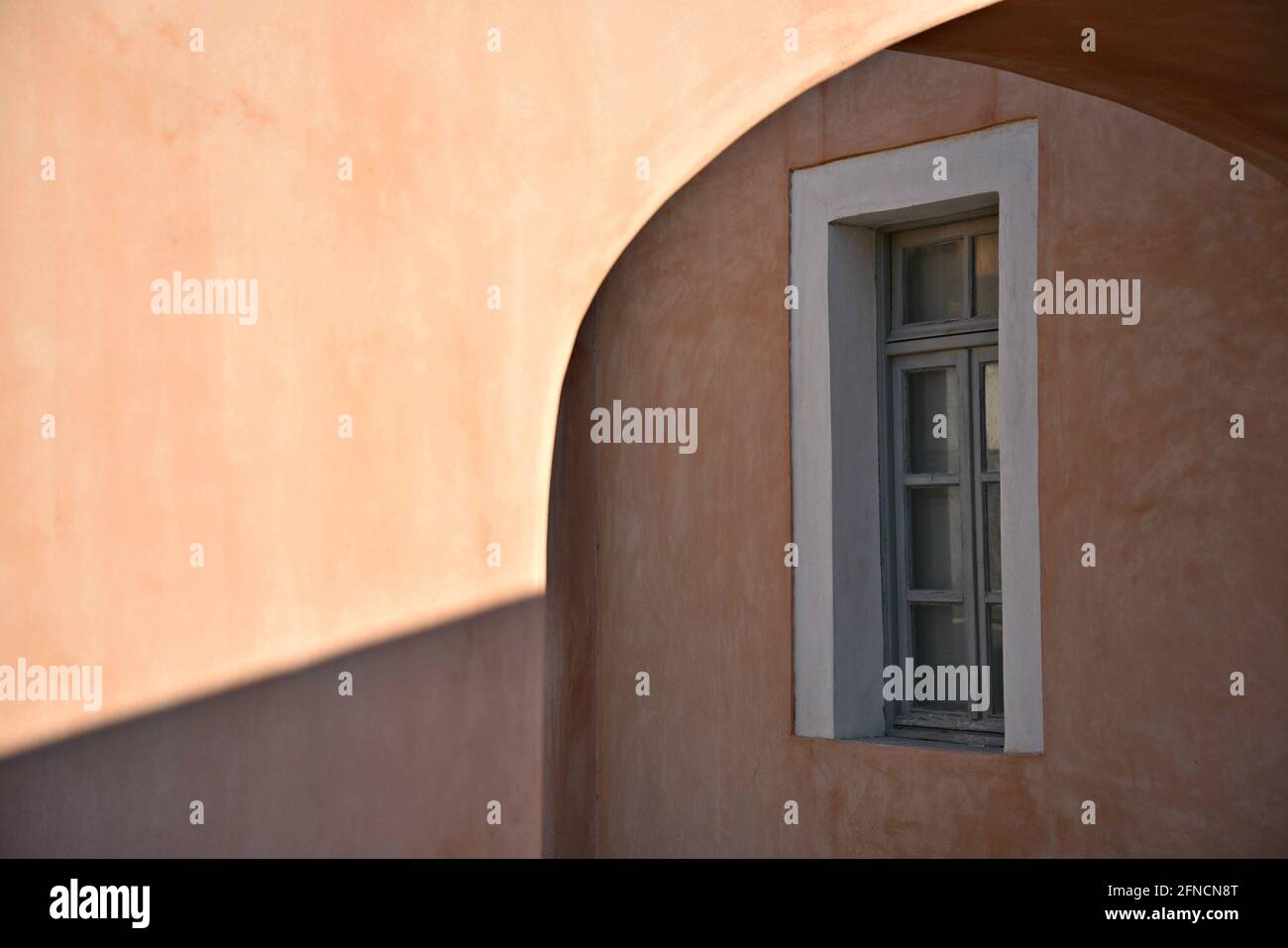 Traditional Cycladic adobe house grey wooden window with white trim on ...