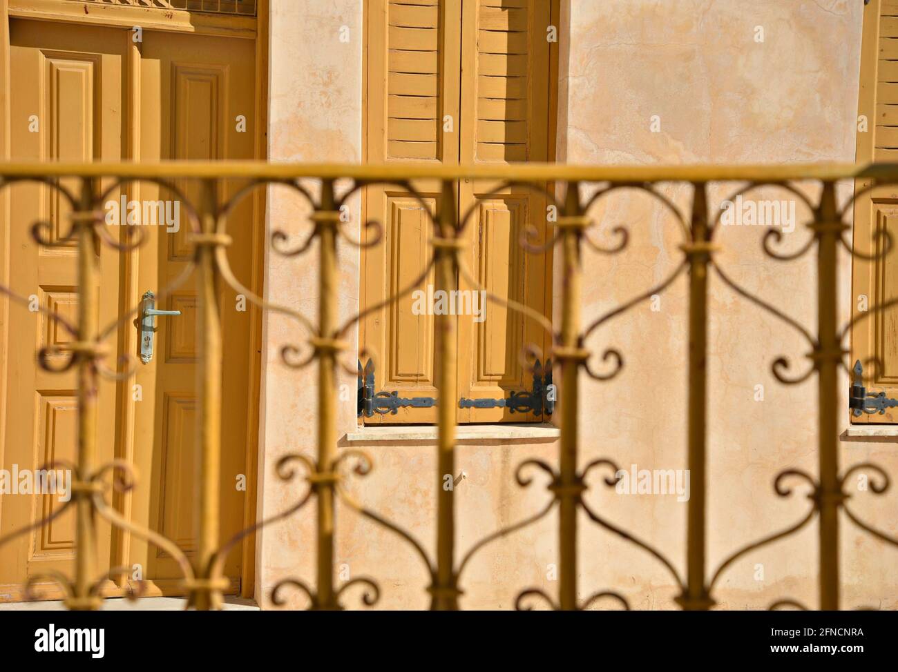 Handcrafted rusty ochre wrought iron railing detail in Santorini island ...