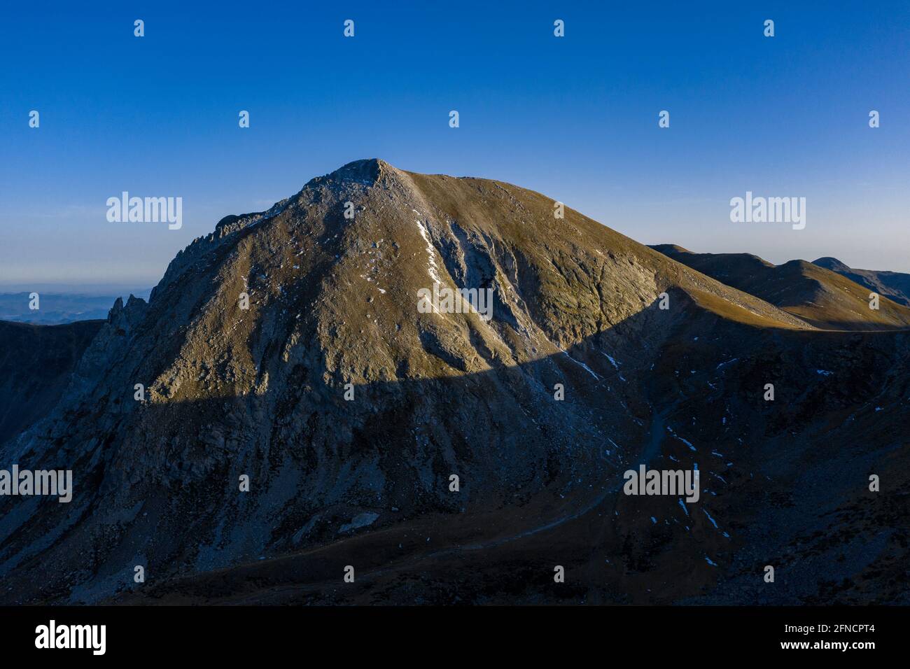 Aerial view of the Gra de Fajol summit at sunset (Ripollès, Catalonia ...