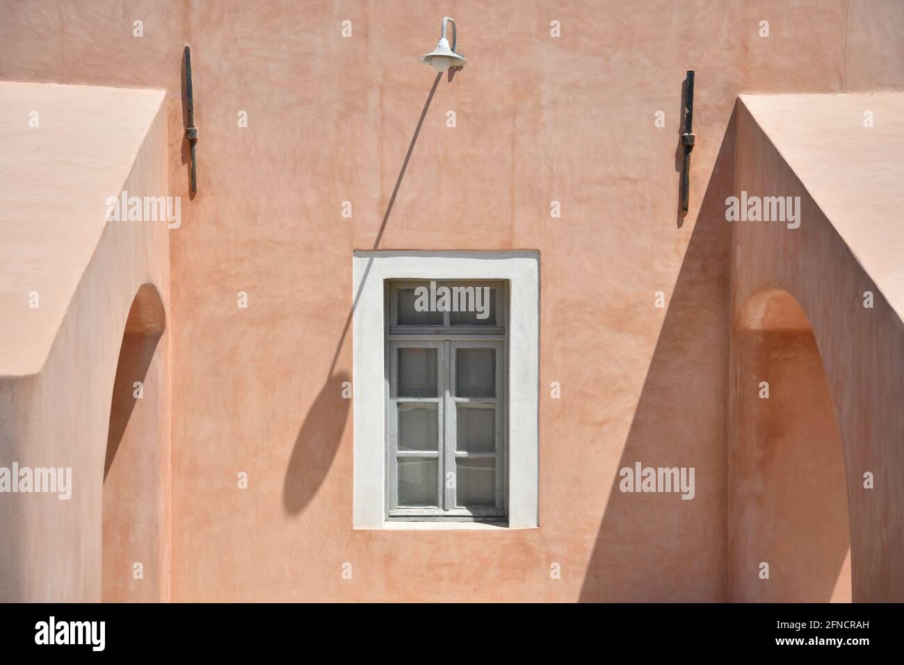 Traditional Cycladic adobe house grey wooden window with white trim on ...