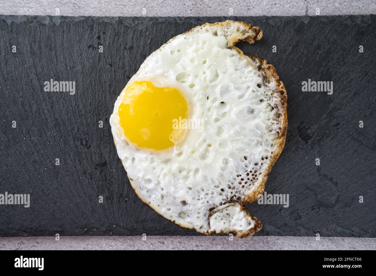 fish-shaped fried egg. food Stock Photo - Alamy