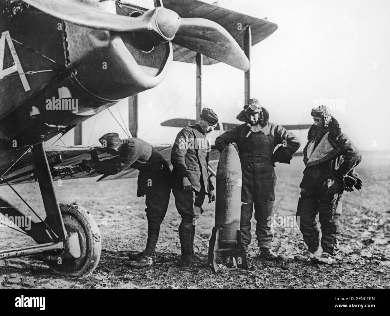 A vintage black and white World War One photograph showing four British Royal Flying Corps ...