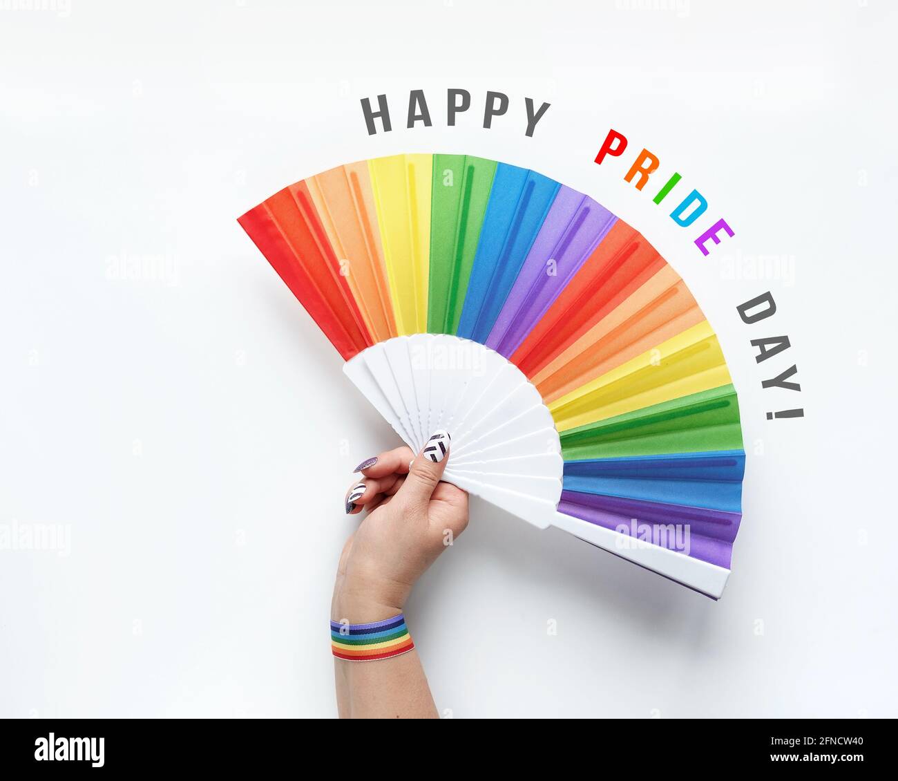 LGBTQ community pride. Hand holds. rainbow fan. Ribbon with rainbow ...