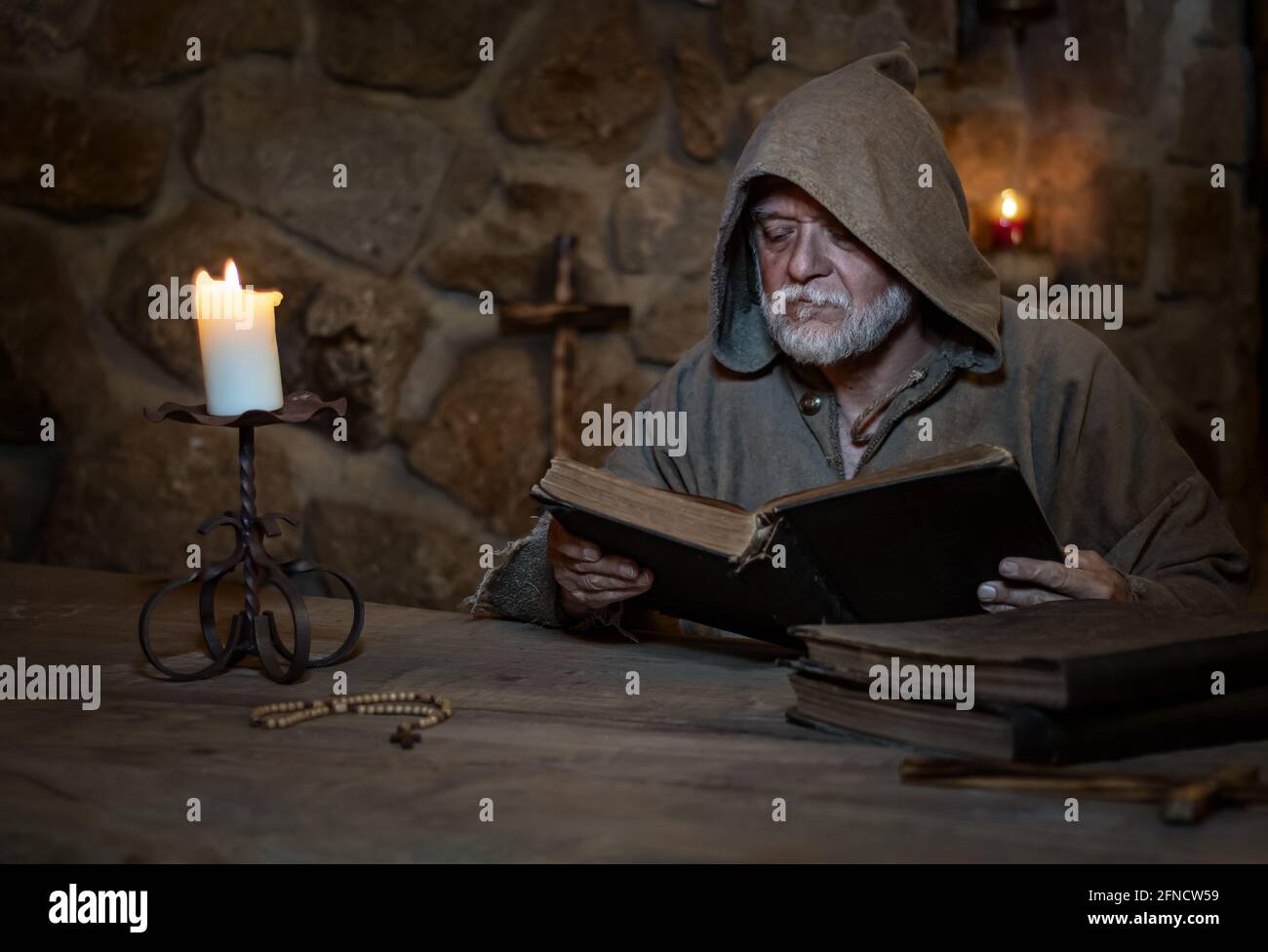 Old studying monk in the Middle Ages Stock Photo - Alamy
