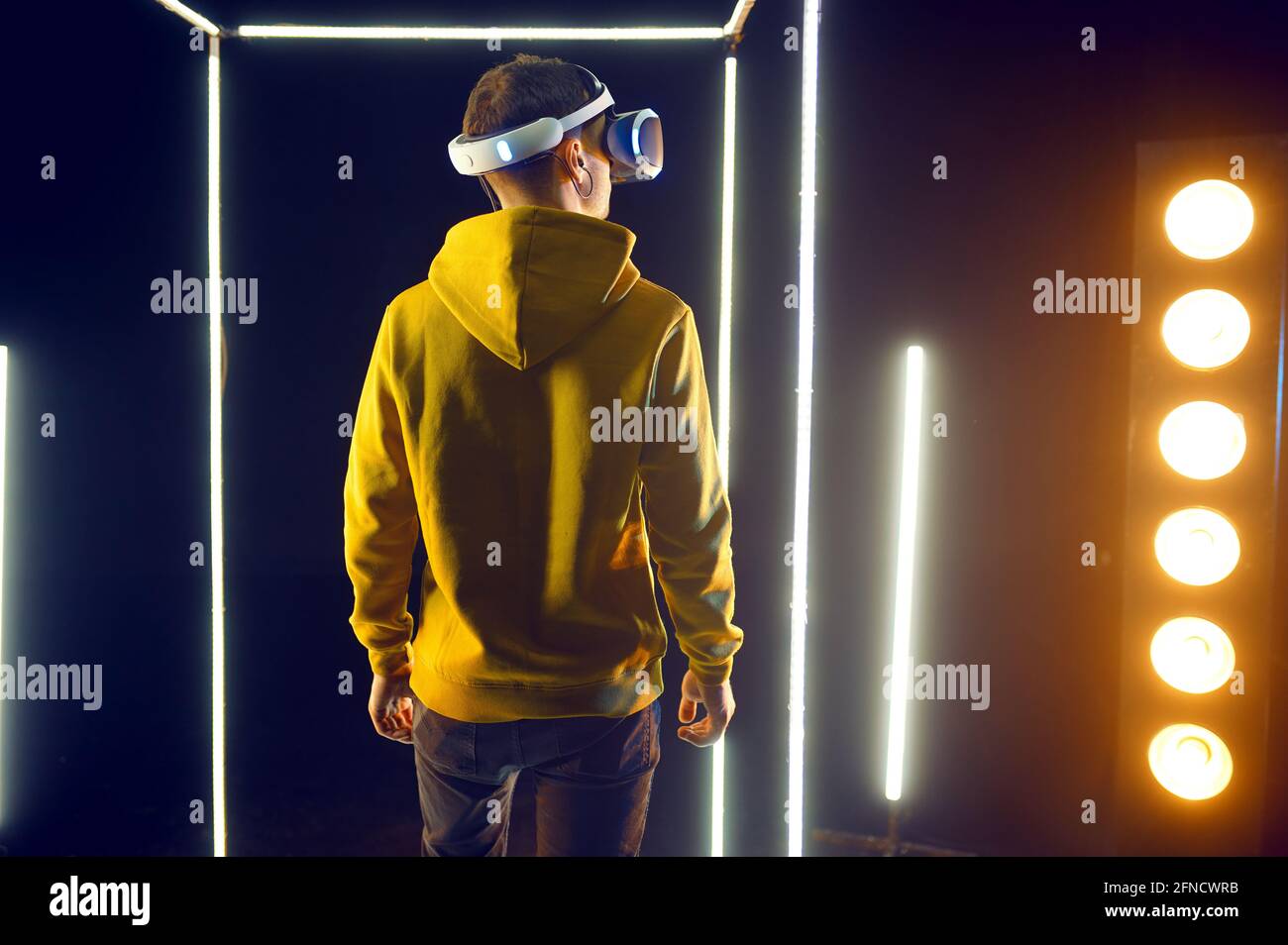 Gamer plays the game using virtual reality helmet Stock Photo - Alamy