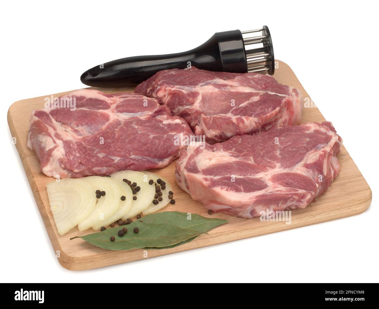 Three raw pork neck meat cuts with black pepper, onion, and bay leaves ...