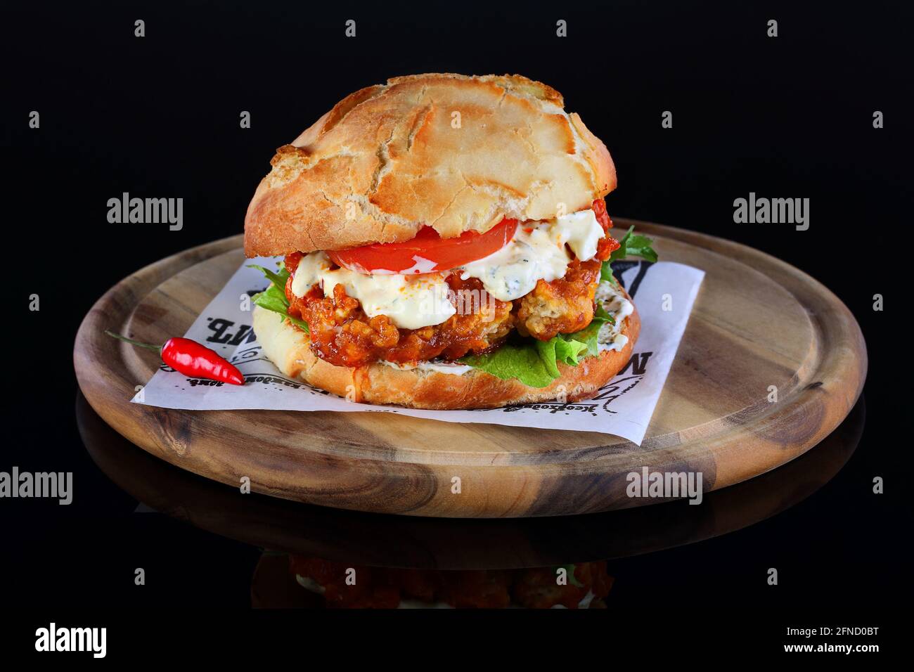 Grilled burger with meat patty, tomato and cheese Stock Photo - Alamy