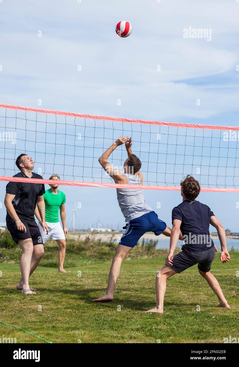 People playing Volleyball on open grassland Stock Photo - Alamy