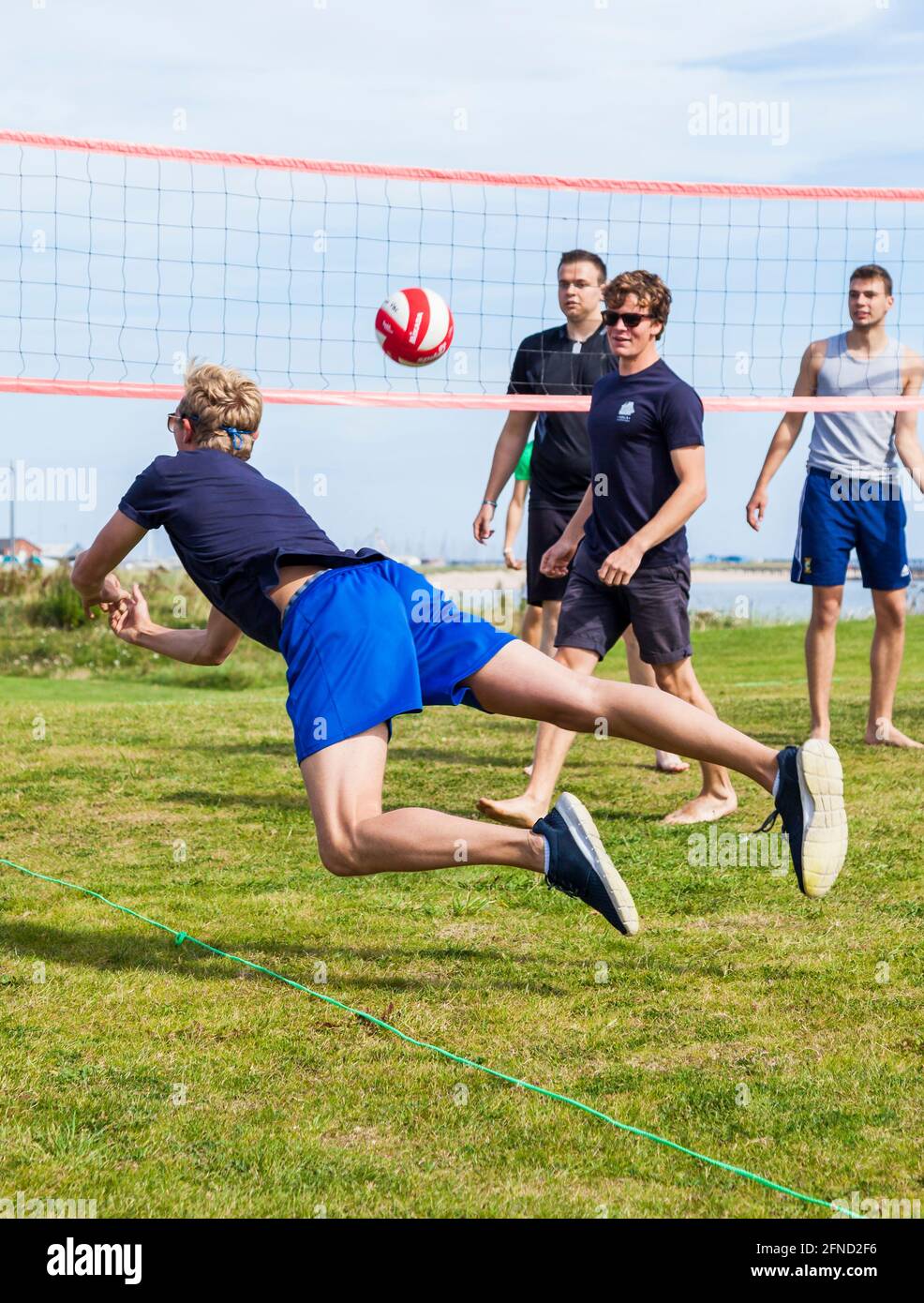 People playing Volleyball on open grassland Stock Photo - Alamy