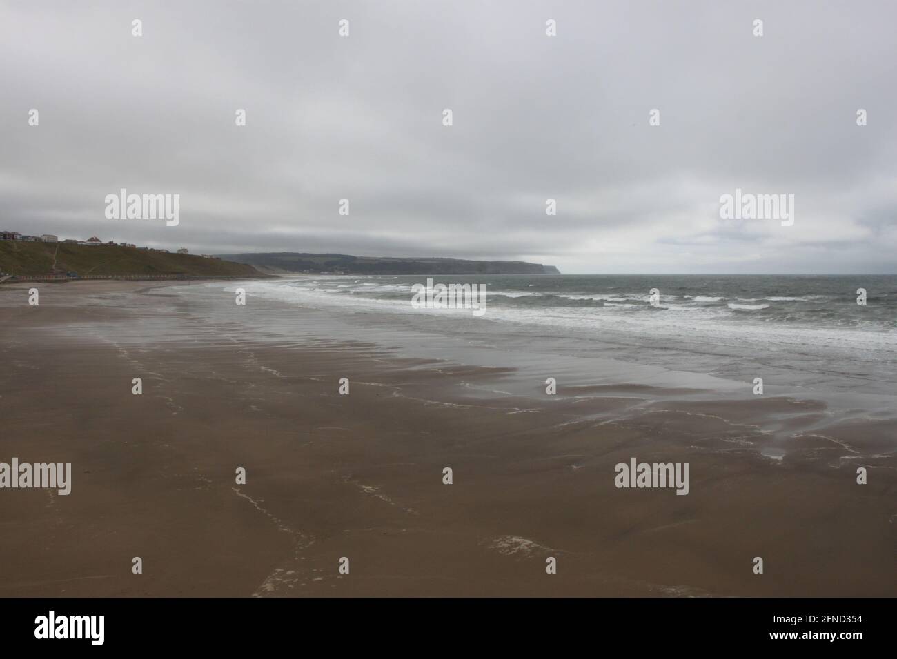 A windswept Whitby beach Stock Photo - Alamy