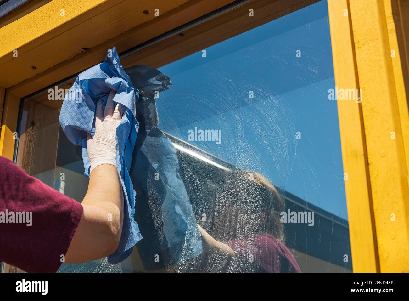 Cleaning girl standing glass hi-res stock photography and images - Alamy