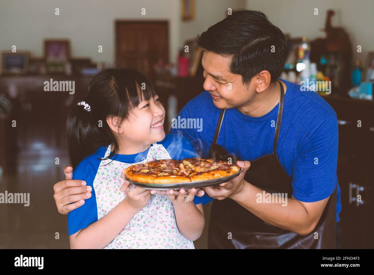 Father and daughter preparing homemade pizza with smile and happy Stock ...