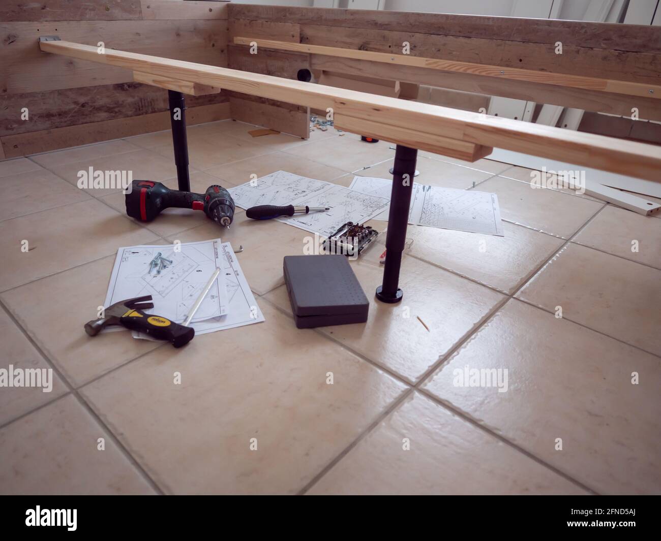 furniture - assembling the bed, lying tools and wooden elements needed ...