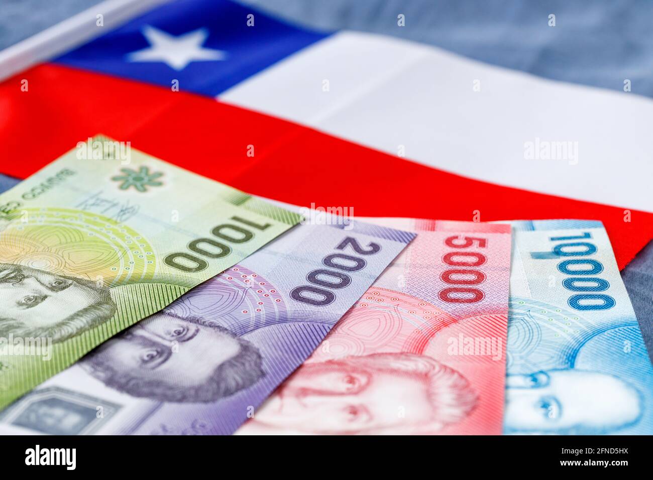 Chilean money on the background of the colors of the national flag ...