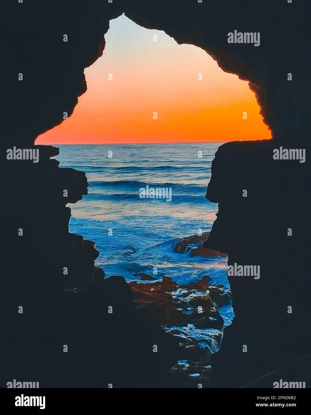 A beautiful shot of Hercules Cave's silhouette in Cape Spartel, Morocco ...