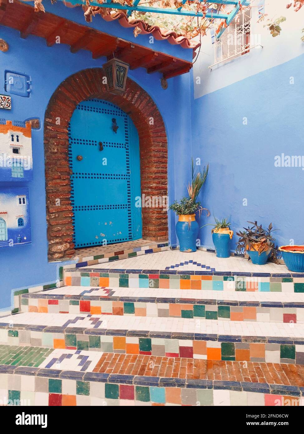 Beautiful vibrant mosaic-covered buildings of Chefchaouen, Morocco ...