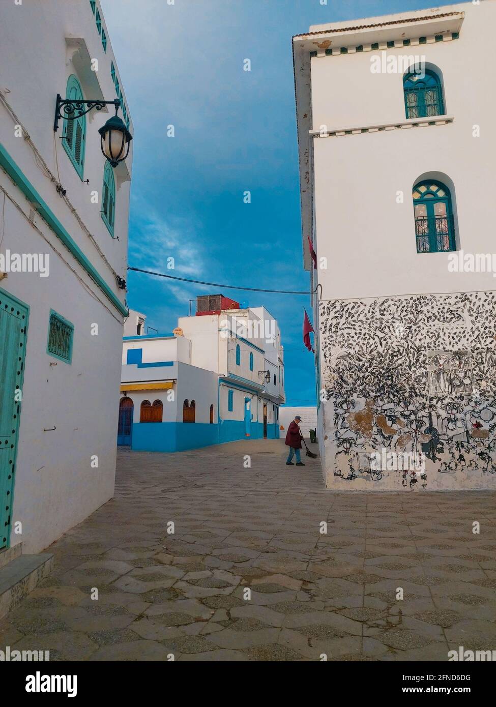 A beautiful shot of traditional white buildings in Asilah, Morocco ...
