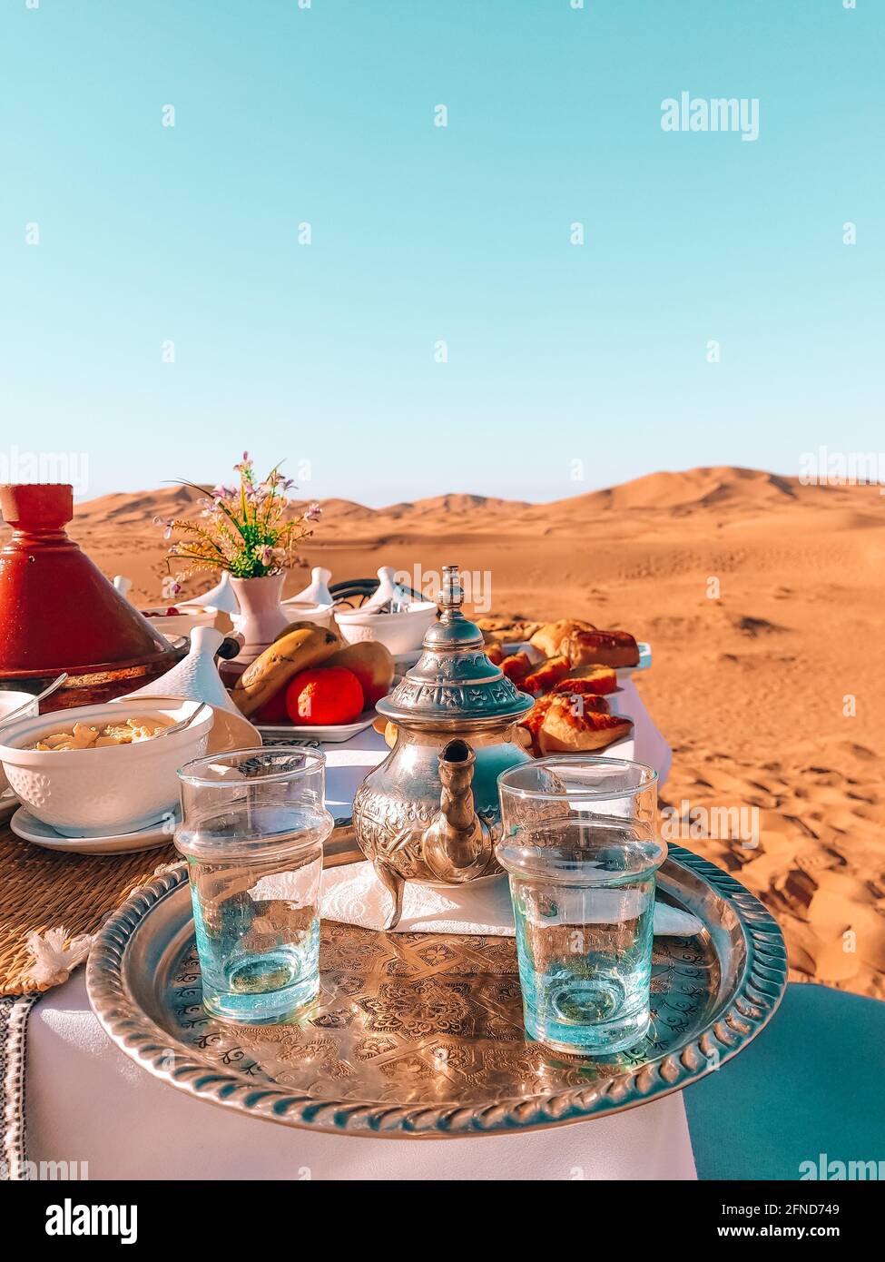 A feast in traditional Arabic utensil with a tea set during Ramadan in ...