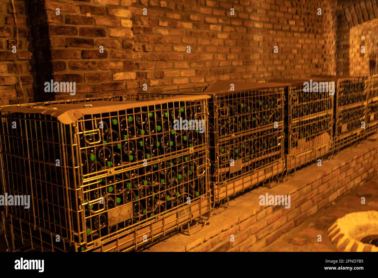 Wine bottles in a wine cellar Stock Photo - Alamy