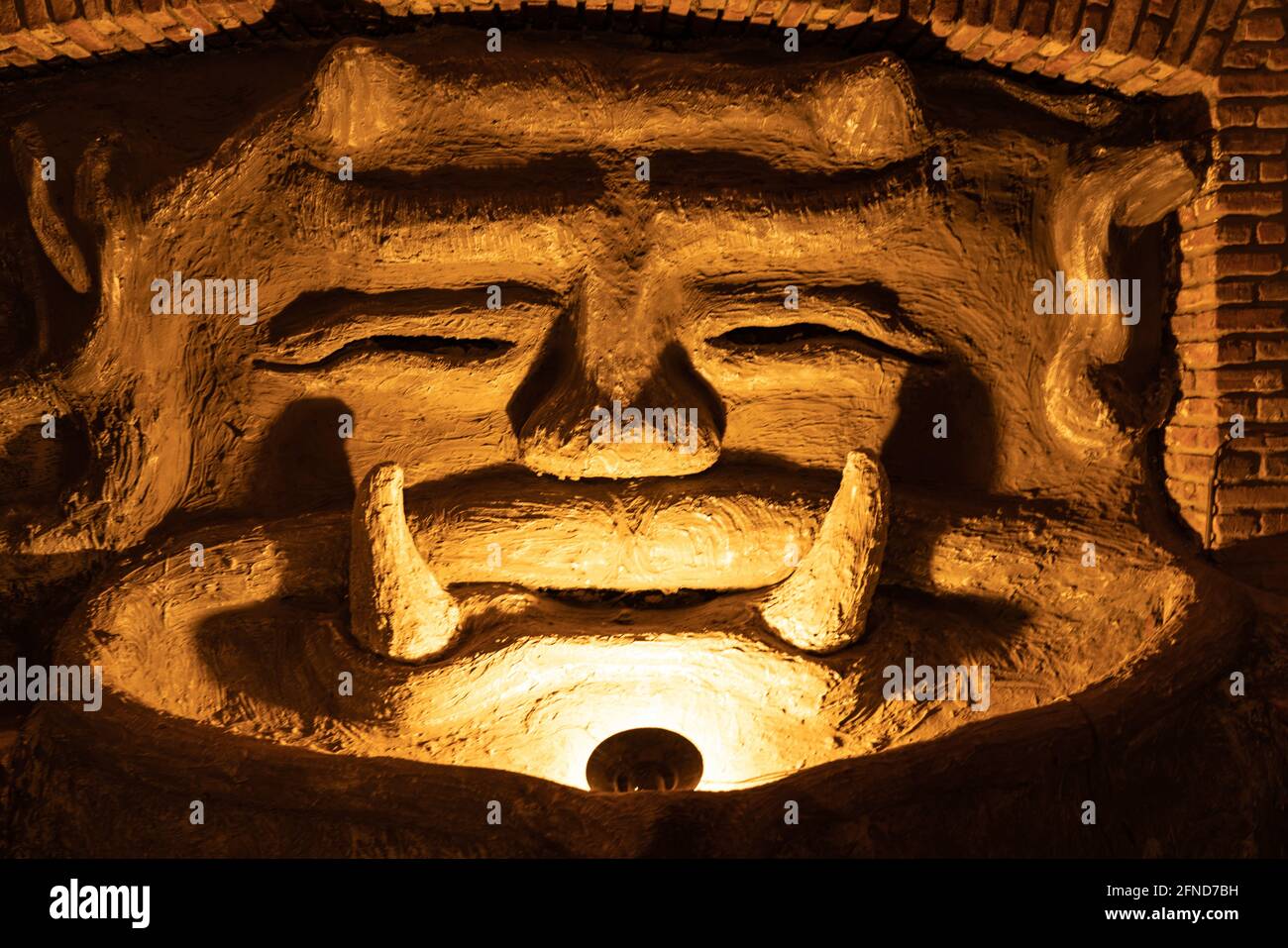 Demon face in the wine cellar Stock Photo - Alamy