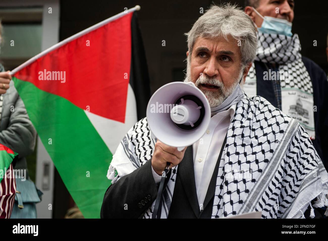 The ambassador of Palestine, Dr. Mahmoud Khalifa speaks through a ...