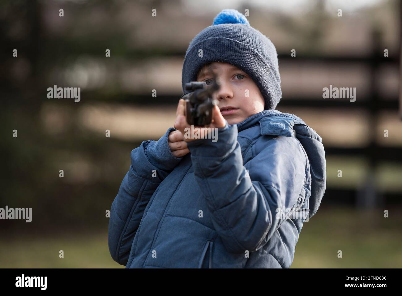 Young boy aim the air rifle Stock Photo - Alamy