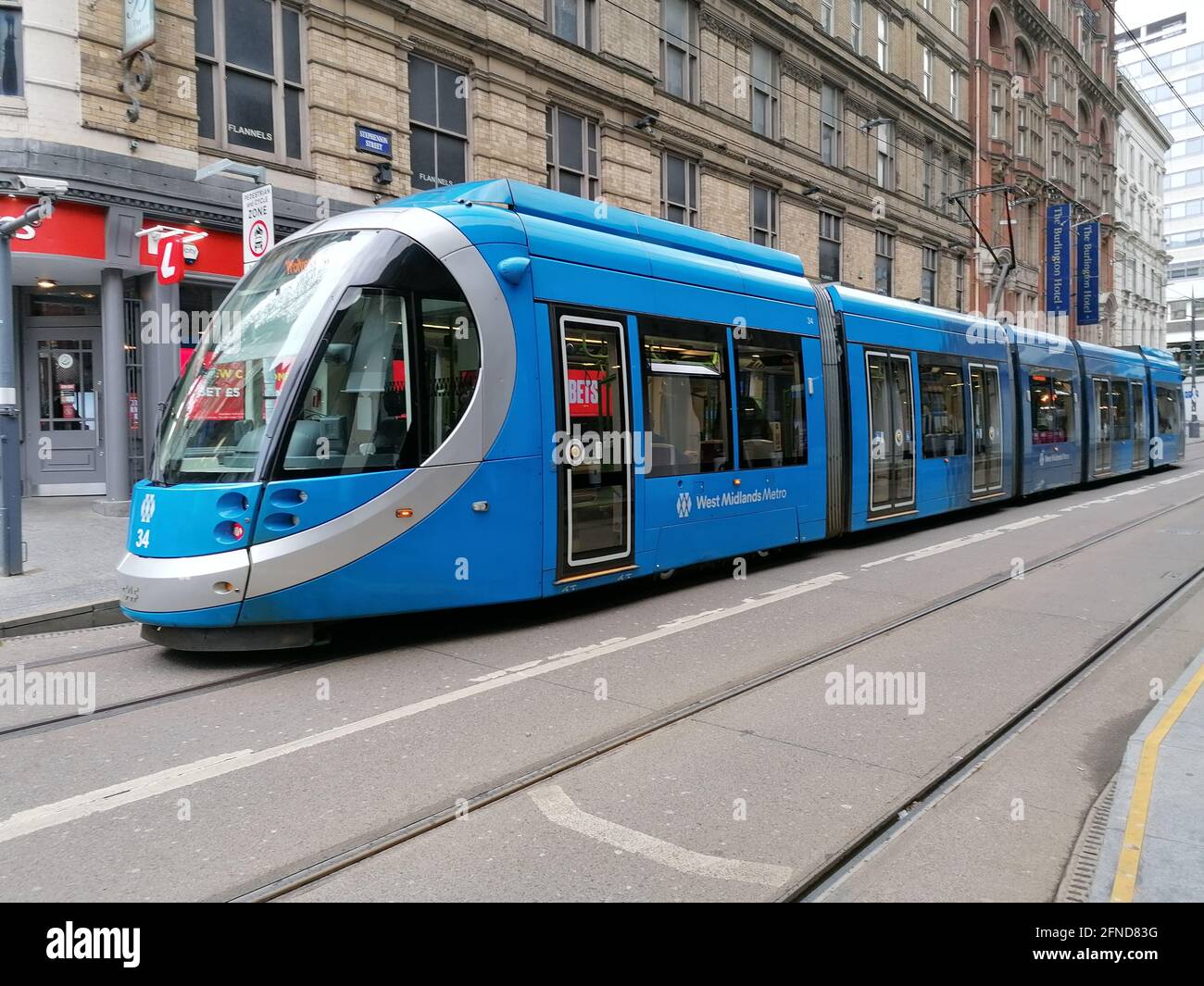 Blue Tram at Birmingham wating its passenger at the station, New Street ...
