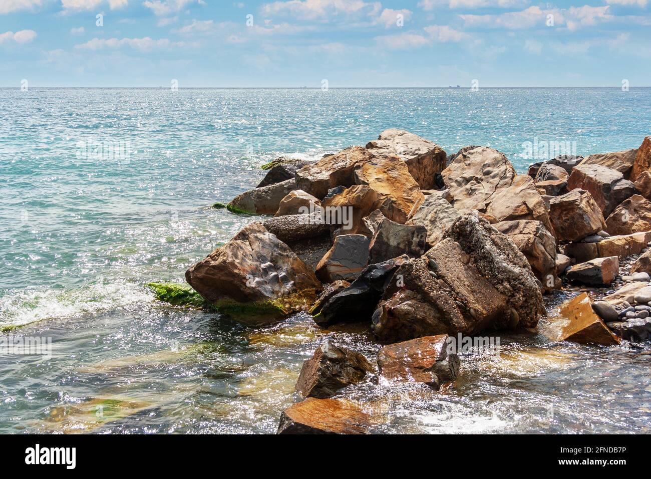 breakwater of large stones on the beach Stock Photo - Alamy
