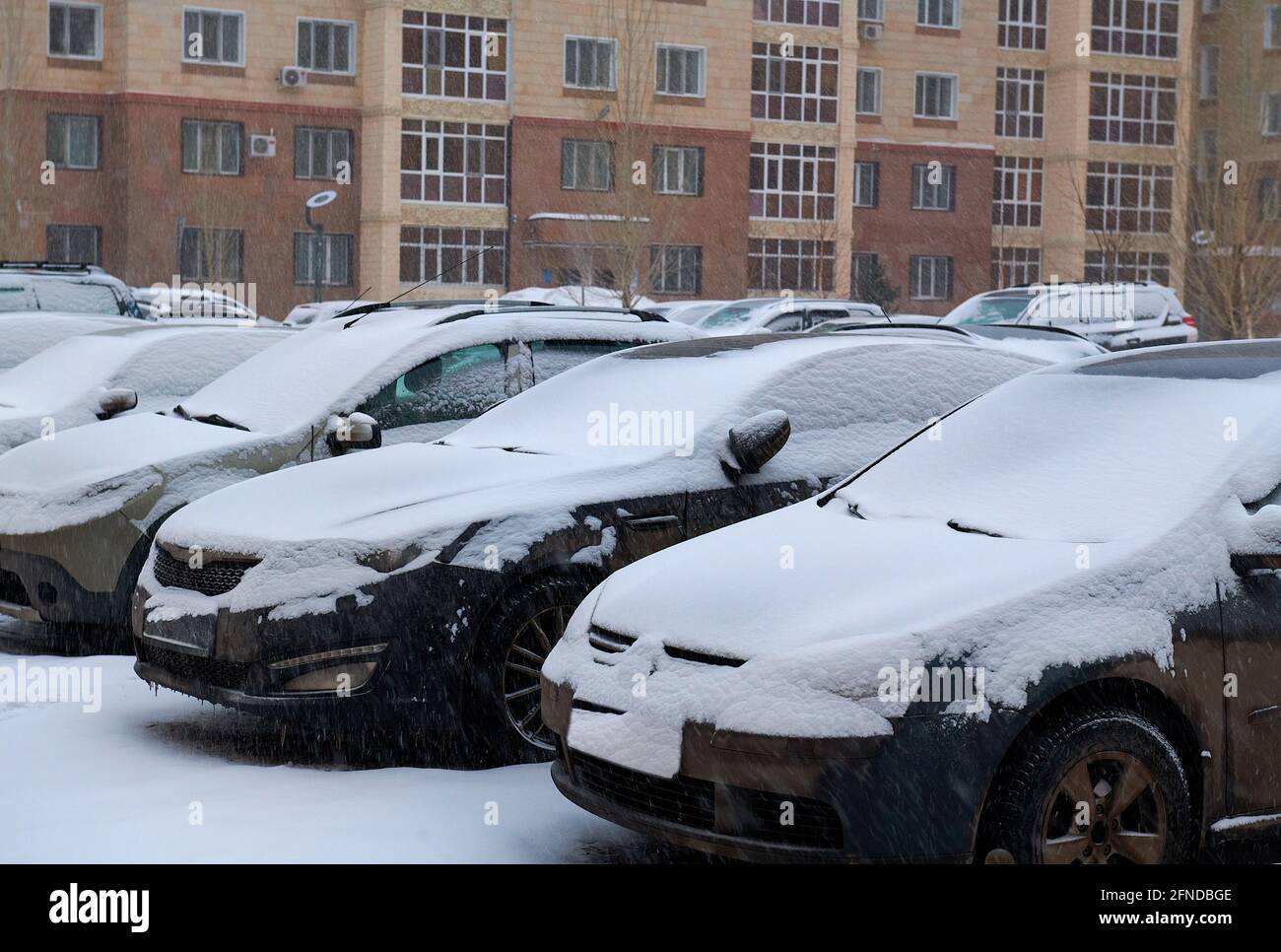different cars stand in the snow in winter Stock Photo - Alamy