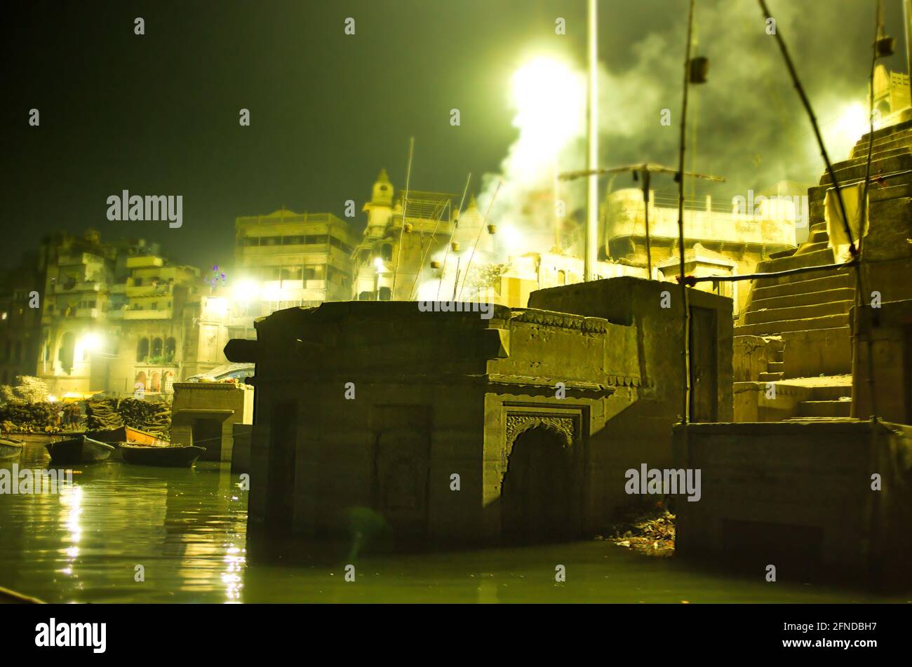Smokes spreading from fire due to cremation next to ganga river in ...