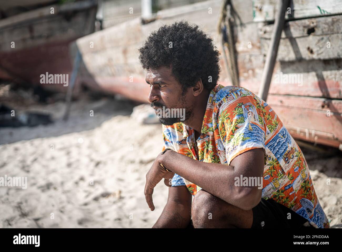 Candid black fisherman on coast the ocean Stock Photo - Alamy