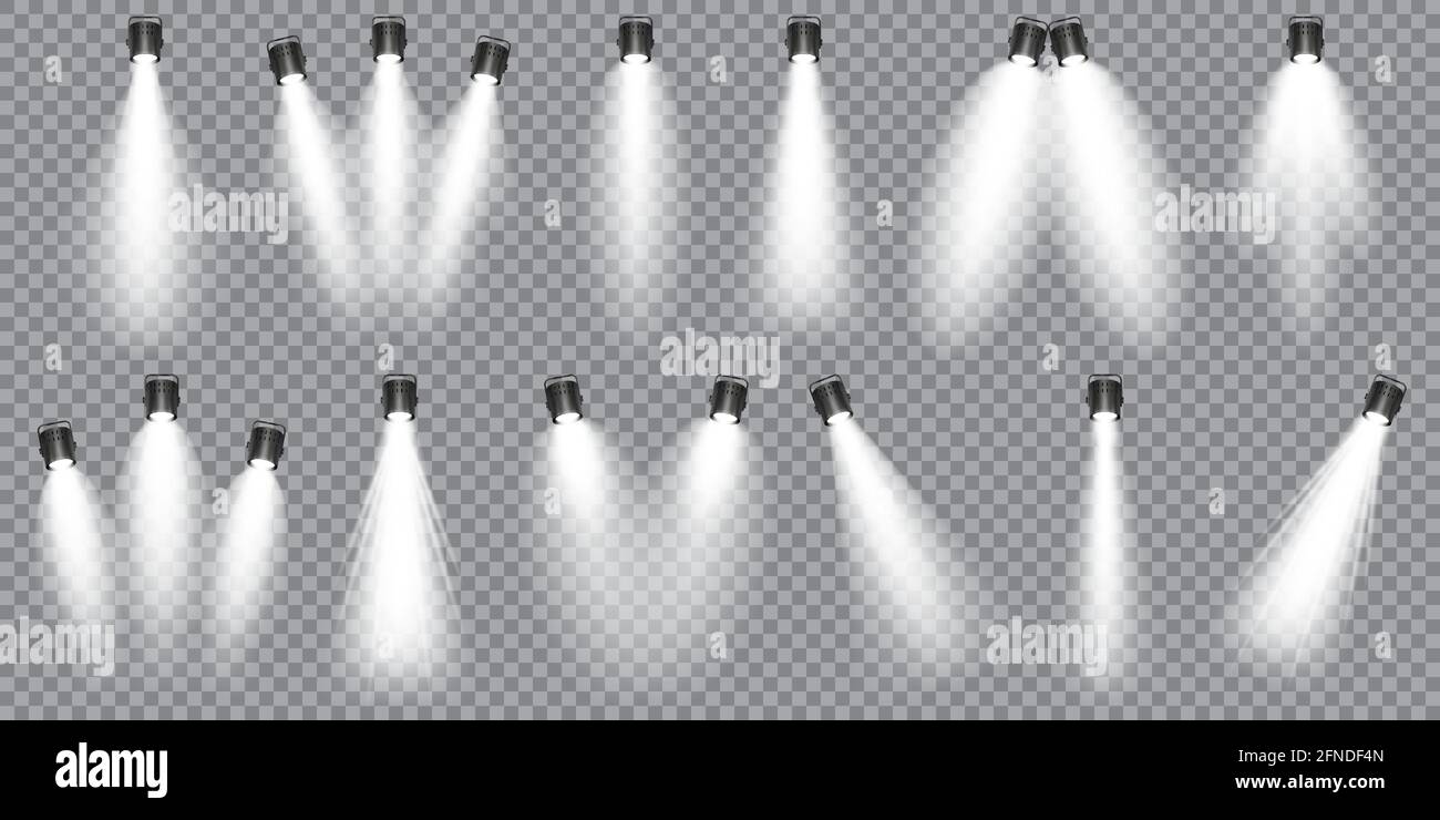 Illuminated studio spotlights collection. Bright light beam ...